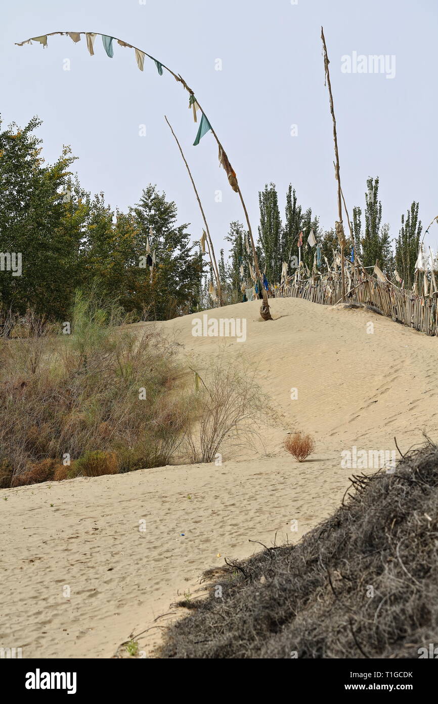 Votive flags-burial mound-Imam Asim's mazar or mausoleum area ...
