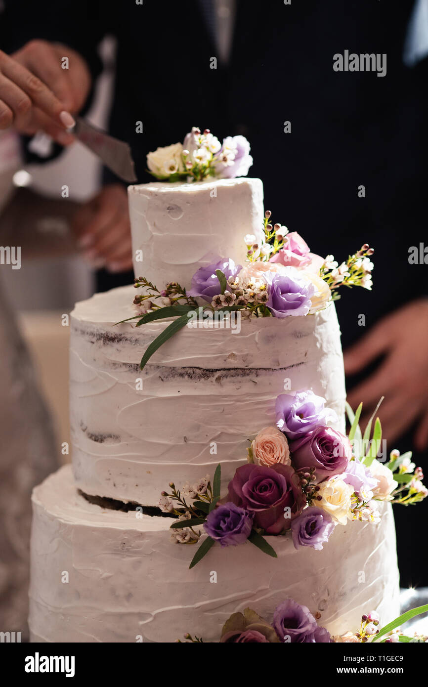 Wedding cake closeup at a real reception and the end of the party ...