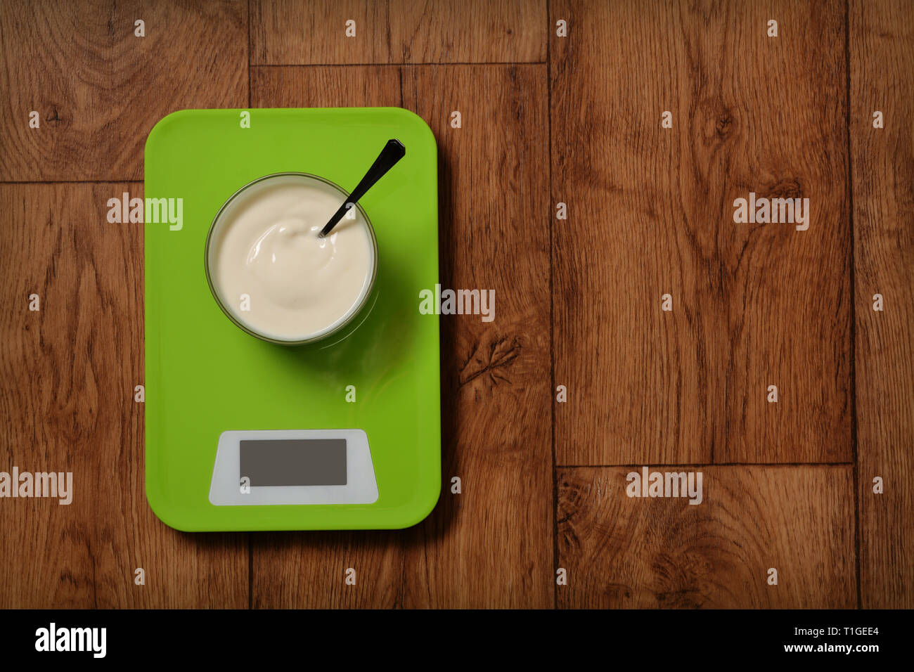 low-fat yogurt on the scale for food - closeup Stock Photo - Alamy