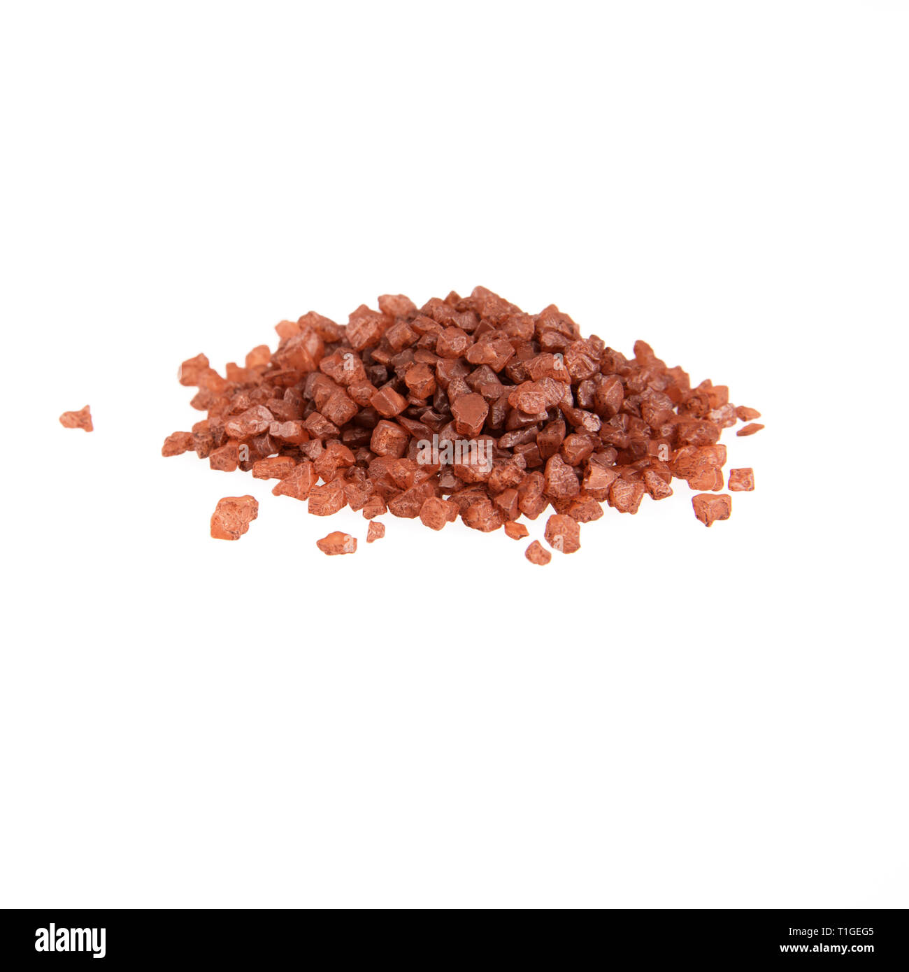 Red Alaea salt isolated on white background Stock Photo - Alamy