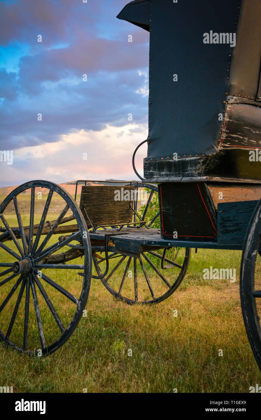 A mysterious and lonesome view of an antique style two seat surrey or ...