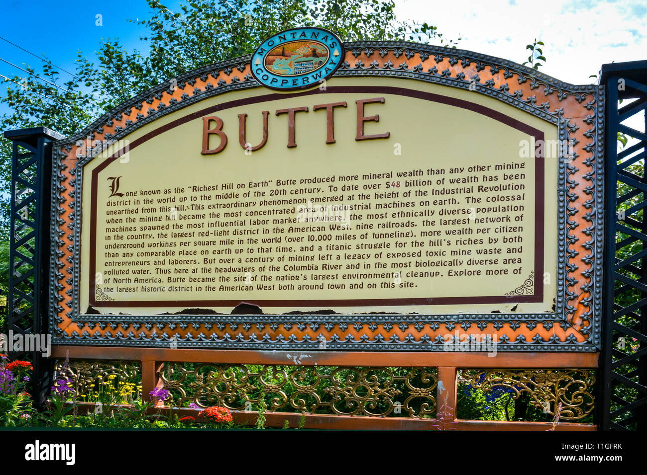 A large and ornate signboard made of copper and iron and dedicated to ...
