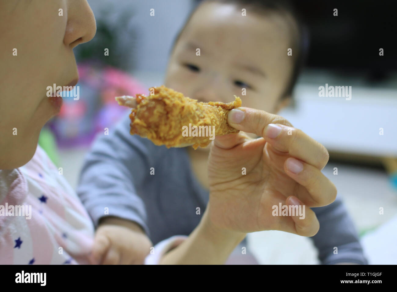Asian woman eating fried chicken hi-res stock photography and images ...