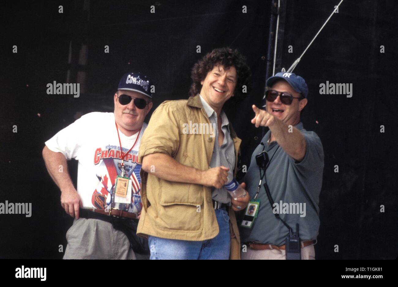 Concert promoters Michael Lang (c) and John Scher (r) are shown ...