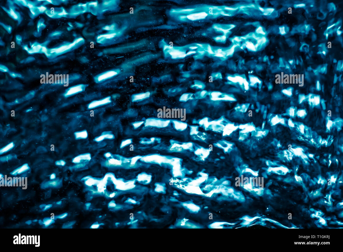 Abstract blue liquid surface as background - futuristic design and ...