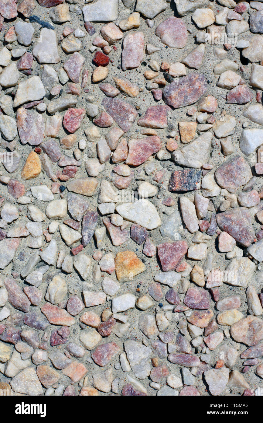 Lovely light colored wall made with colorful pebble stones. Texture of ...