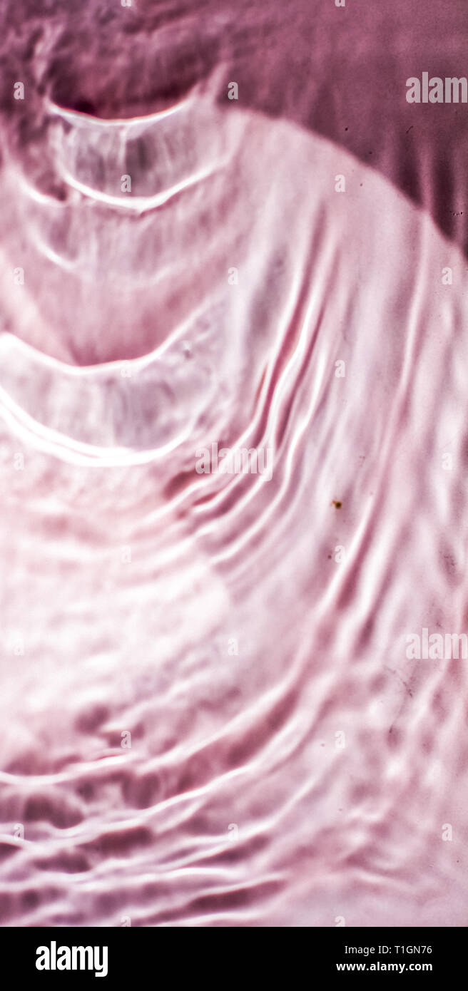 Pink flowing water texture as an abstract background - colourful ...