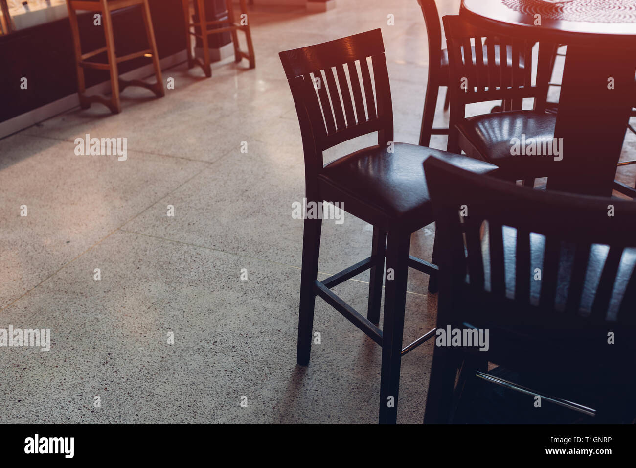 Empty cafe. Wooden chairs beside bar counter. Seats in circle Stock ...