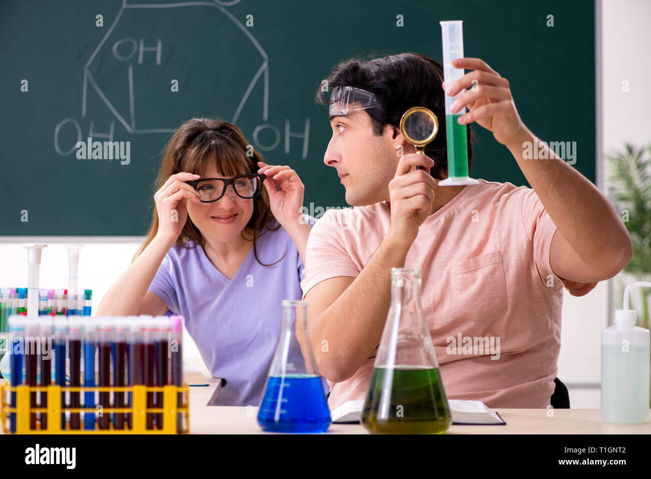 Two chemists students in classroom Stock Photo - Alamy