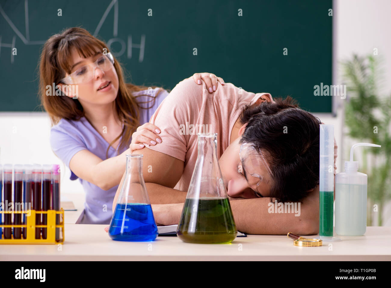 Two chemists students in classroom Stock Photo - Alamy