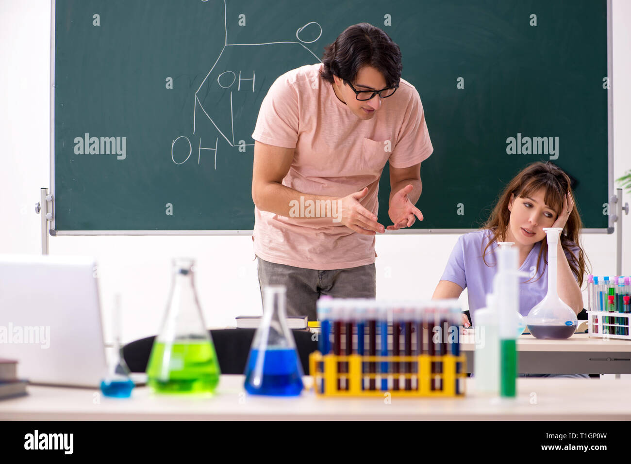 Two chemists students in classroom Stock Photo - Alamy