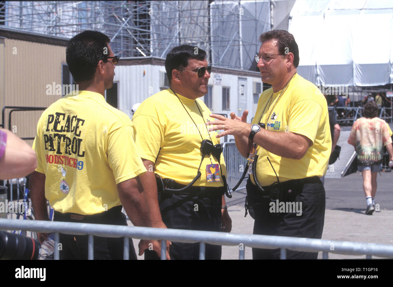 Concert security staff (Peace Patrol) are shown having a candid ...