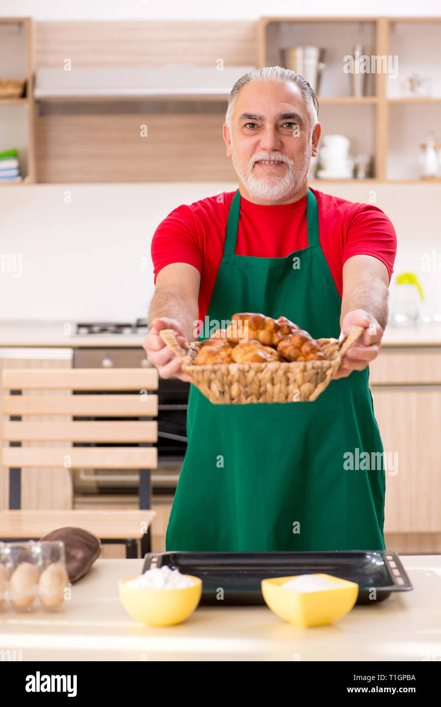Happy baker presenting loaf bread hi-res stock photography and images ...