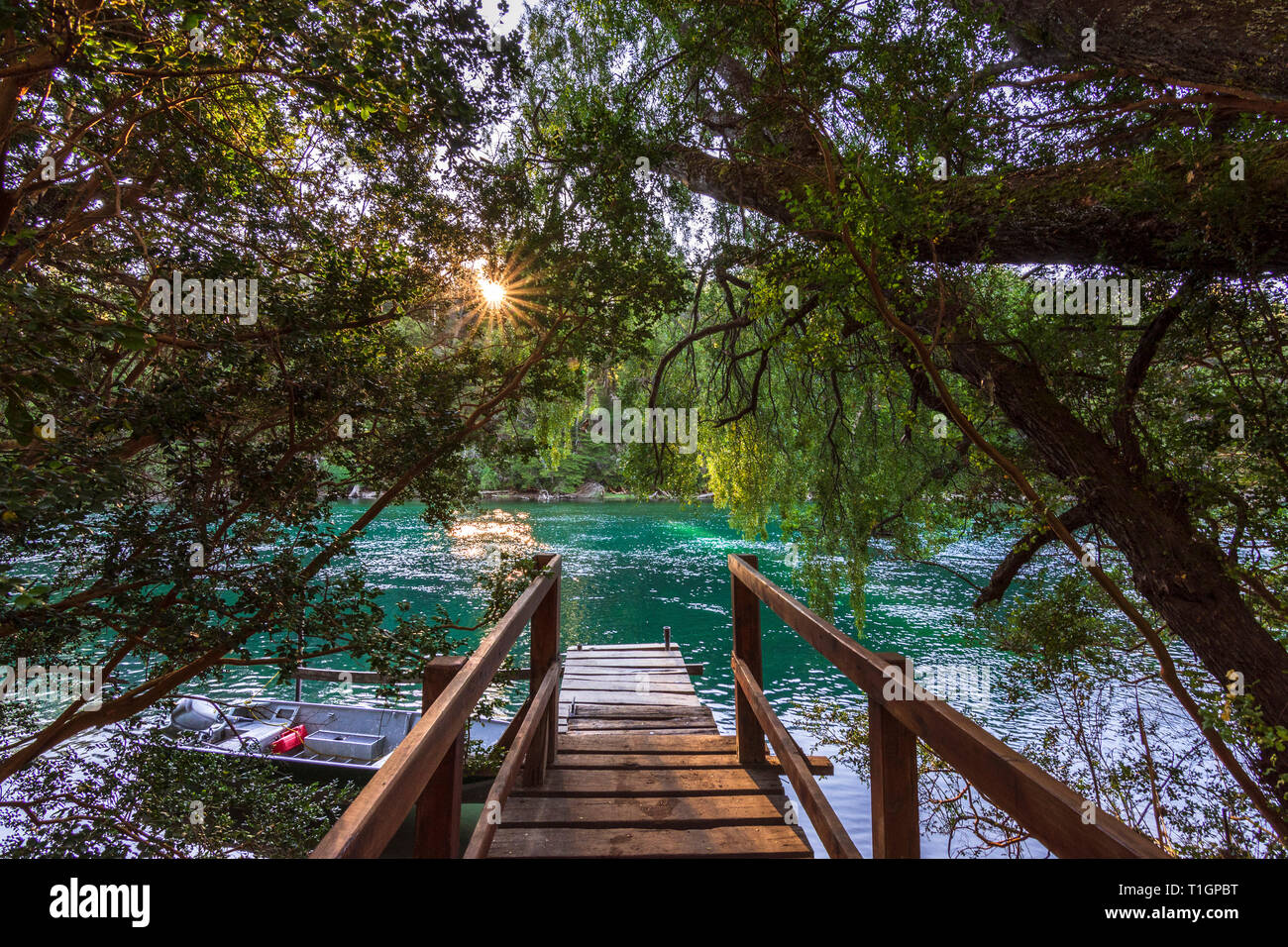 Moored boat at Arrayanes river dock in Los Alerces National Park ...