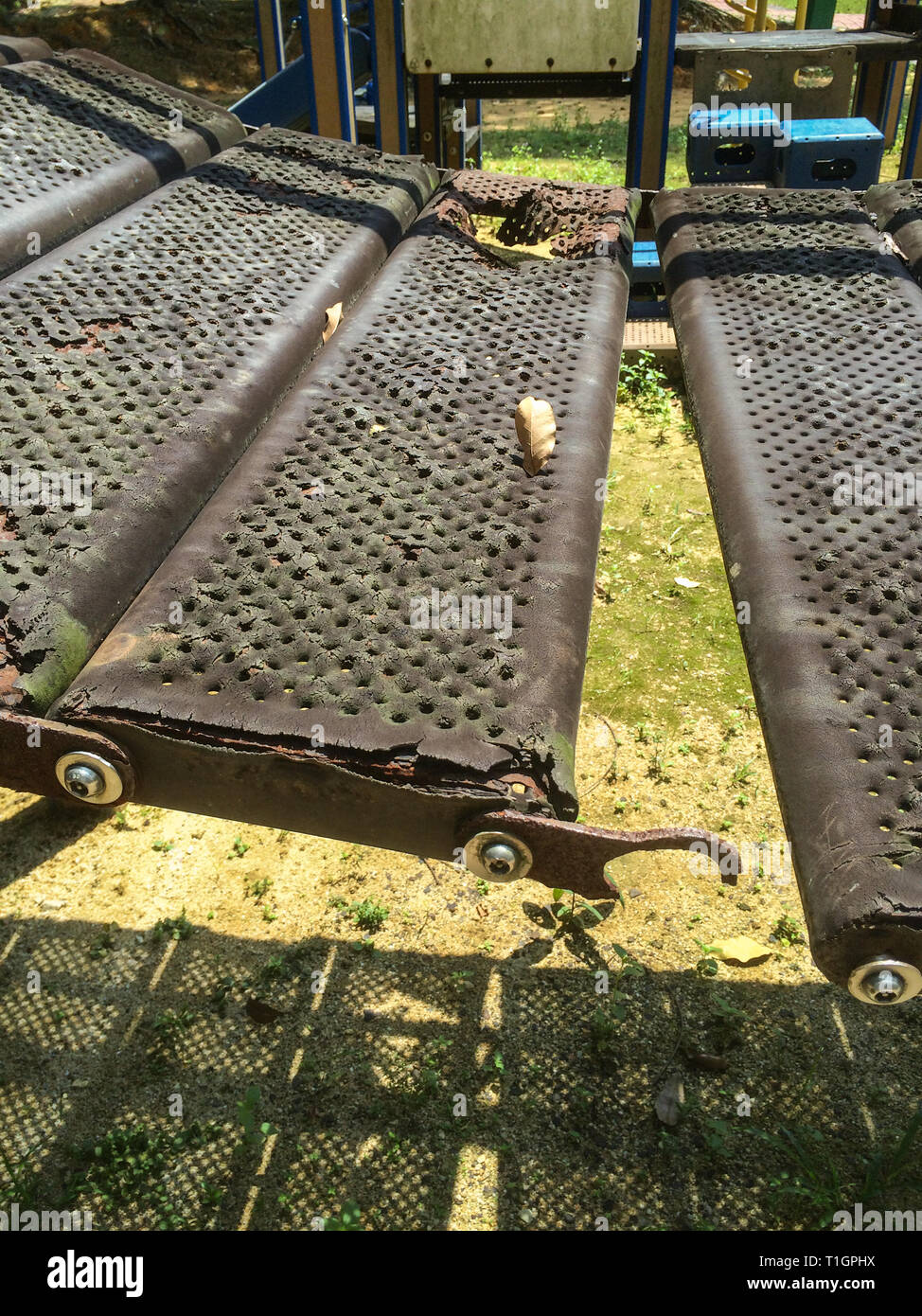 Health and safety in a playpark in Malaysia Stock Photo - Alamy