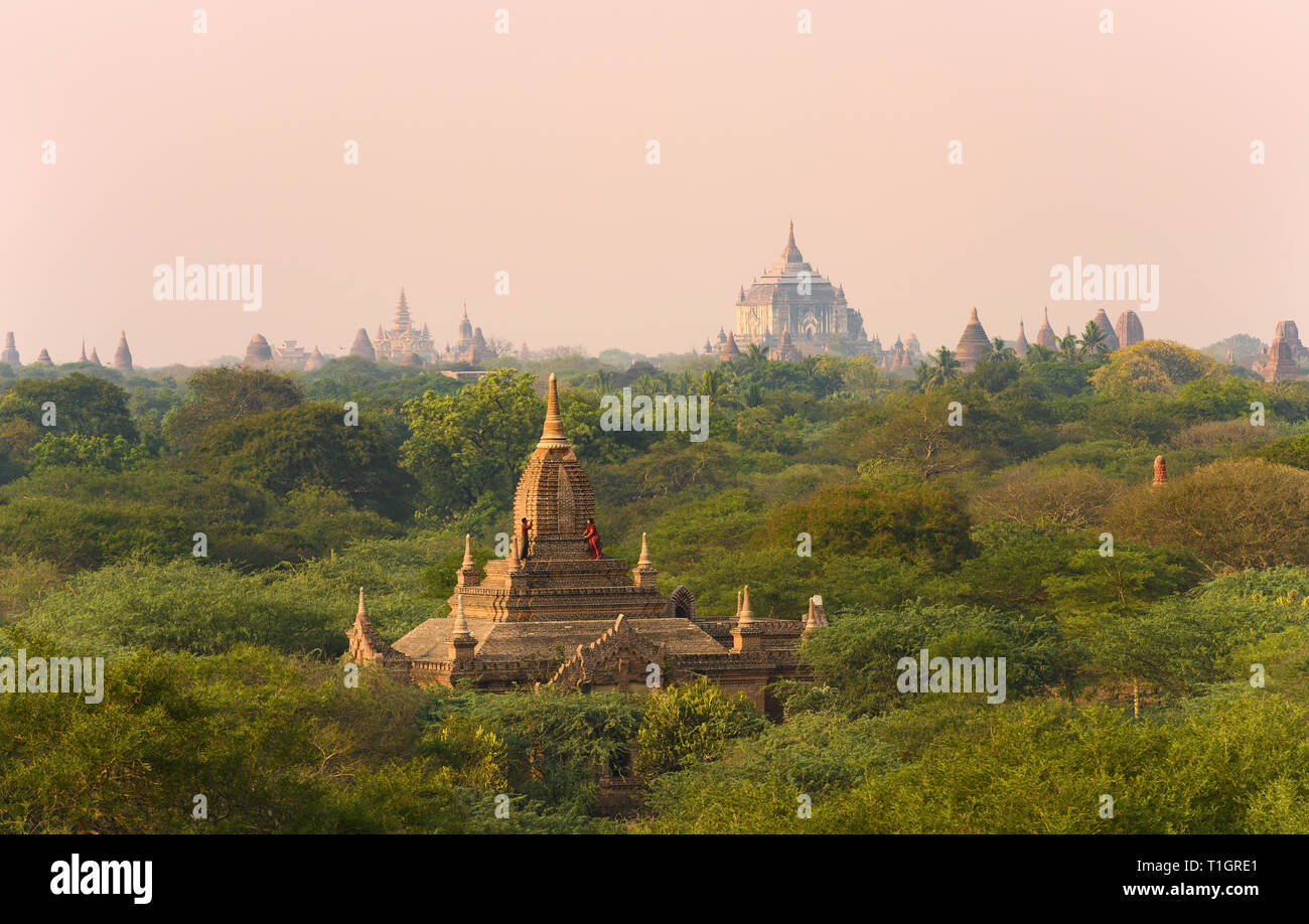 A unidentified Burmese couple, wearing a traditional Longyi, are taking ...