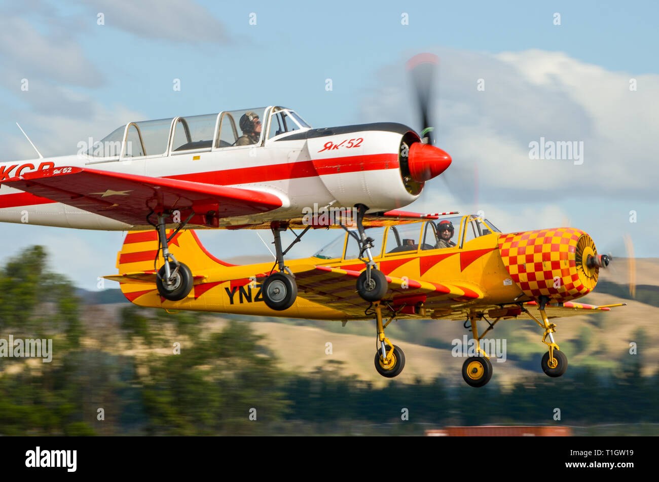 Two Yakovlev Yak-52 planes taking off at Wings over Wairarapa airshow ...