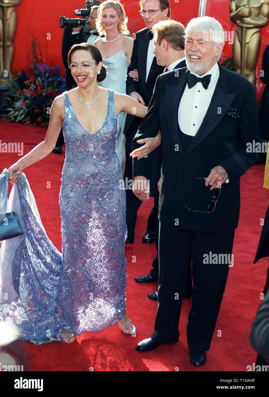 LOS ANGELES, CA - March 21, 1999: Actor JAMES COBURN & wife PAULA MURAD ...
