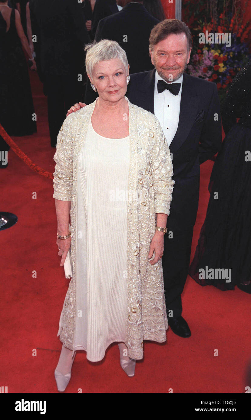 LOS ANGELES, CA - March 22, 1999: Actress JUDI DENCH & actor husband ...