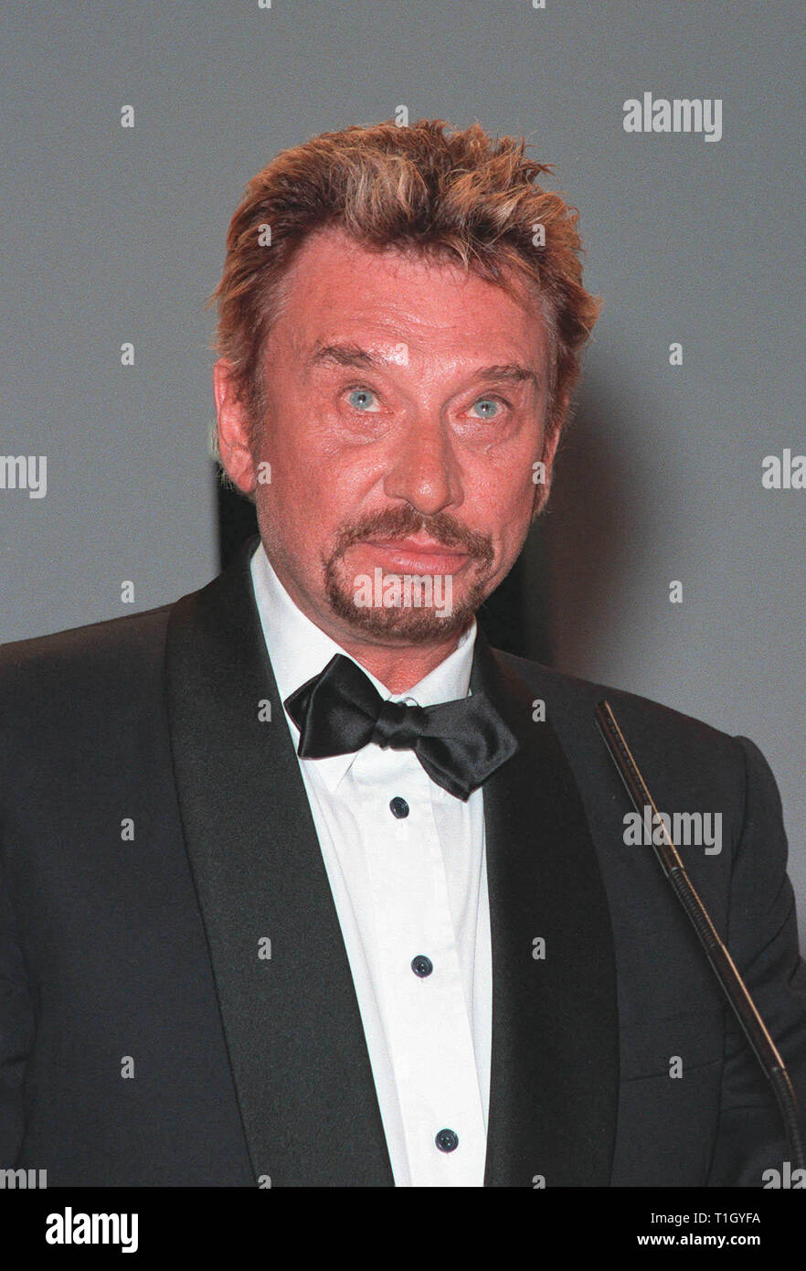 CANNES, FRANCE: 23 MAY 1999: French actor JOHNNY HALLYDAY at the 52nd ...