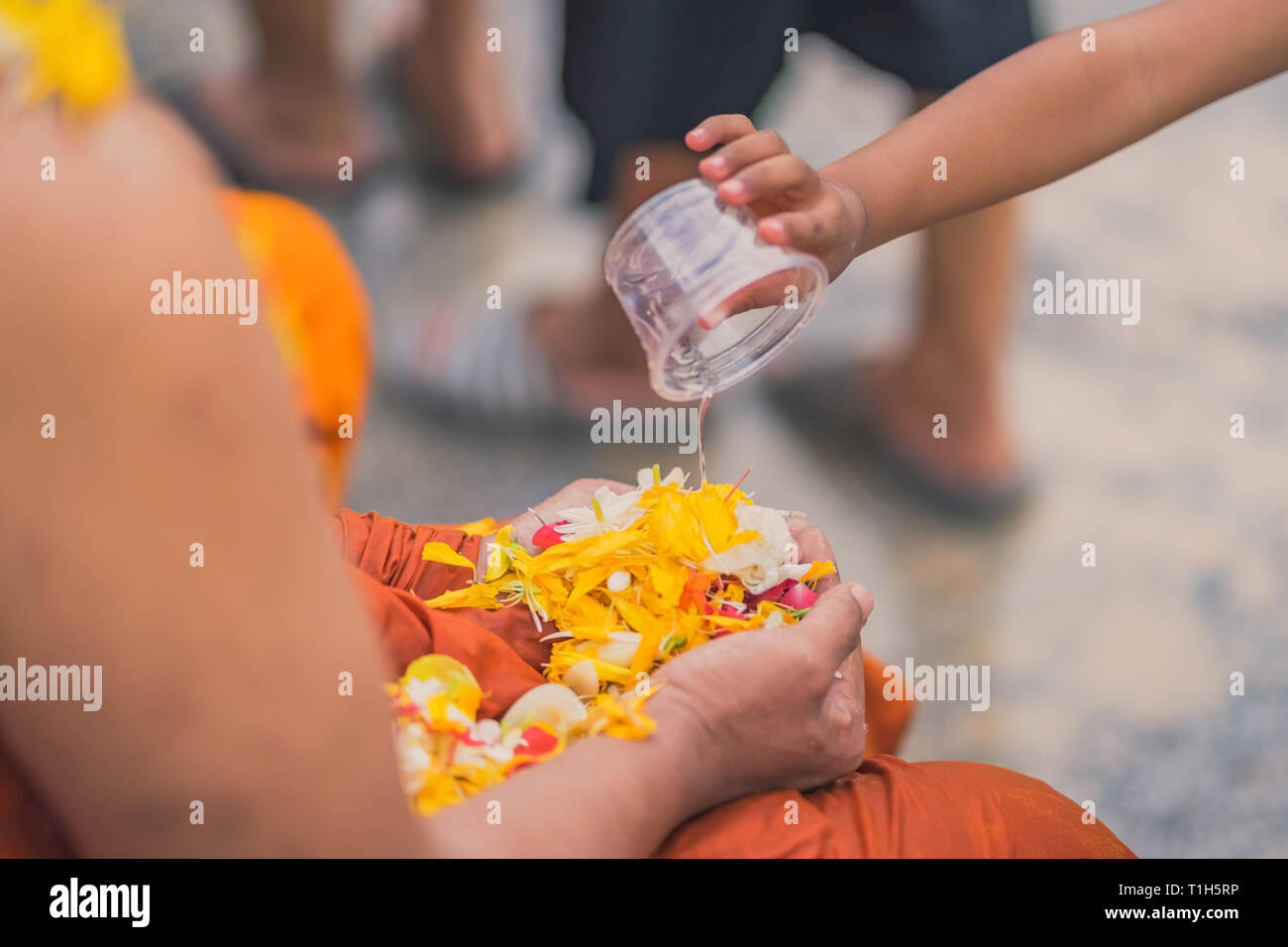 Hands pouring blessing water hi-res stock photography and images - Alamy