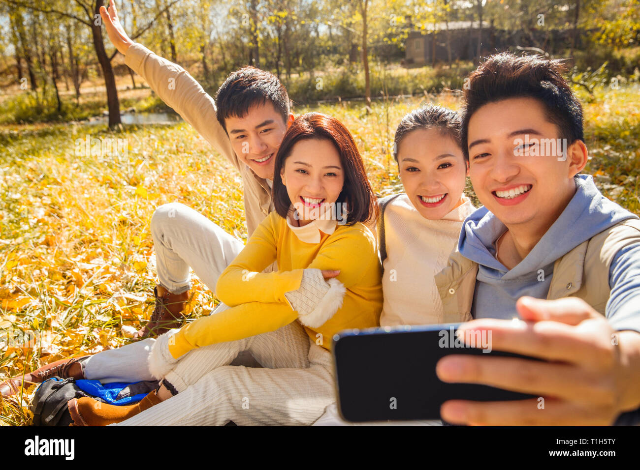 Young men and women in the outdoor outing Stock Photo - Alamy