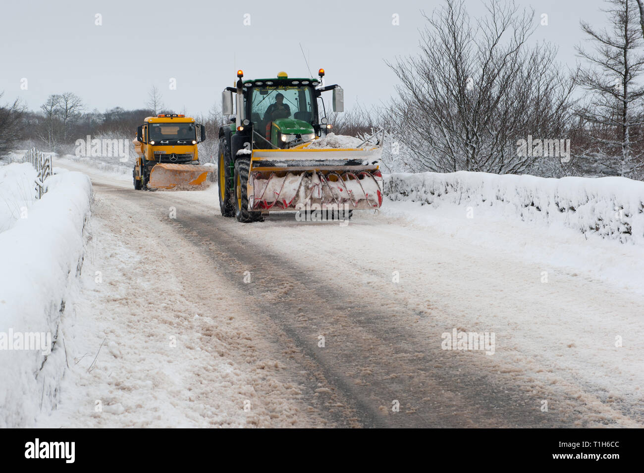 vehicles clearing snow from road in rural location on Dartmoor Stock ...