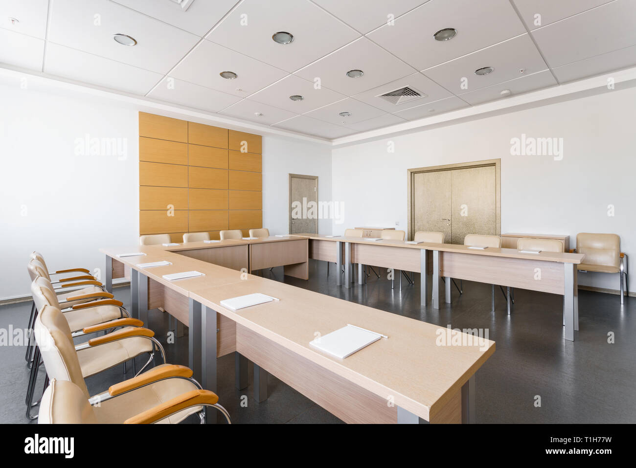 Empty modern conference hall in new hotel. Room for training, education ...