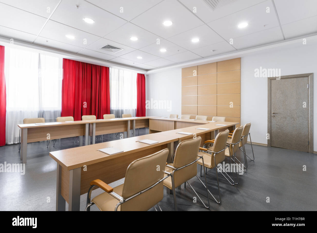 Empty modern conference hall in new hotel. Room for training, education ...