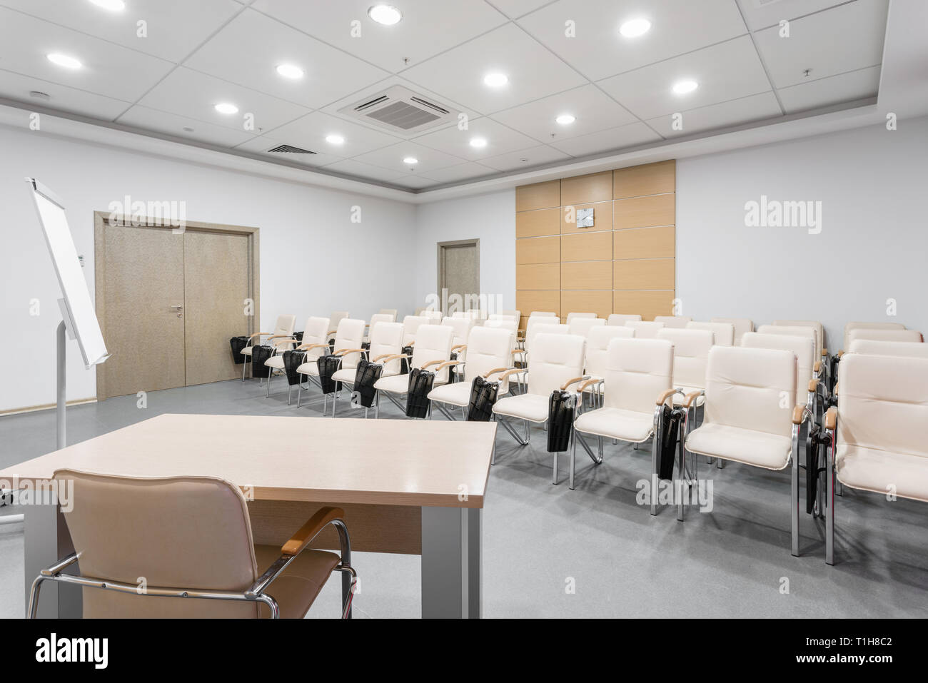 Empty modern conference hall in new hotel. Room for training, education ...