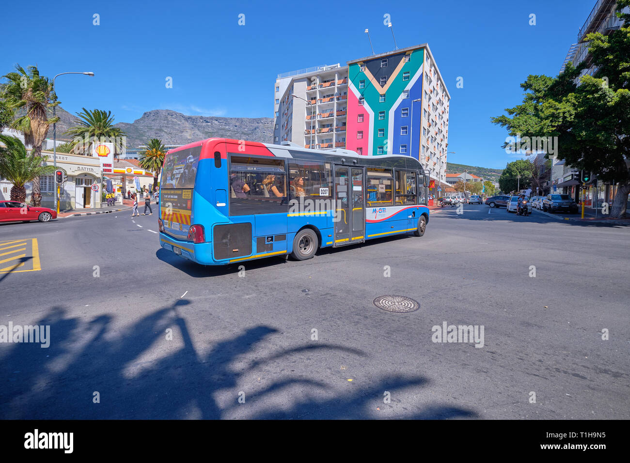 Myciti bus turning on Street in centre with Table Mountain in ...