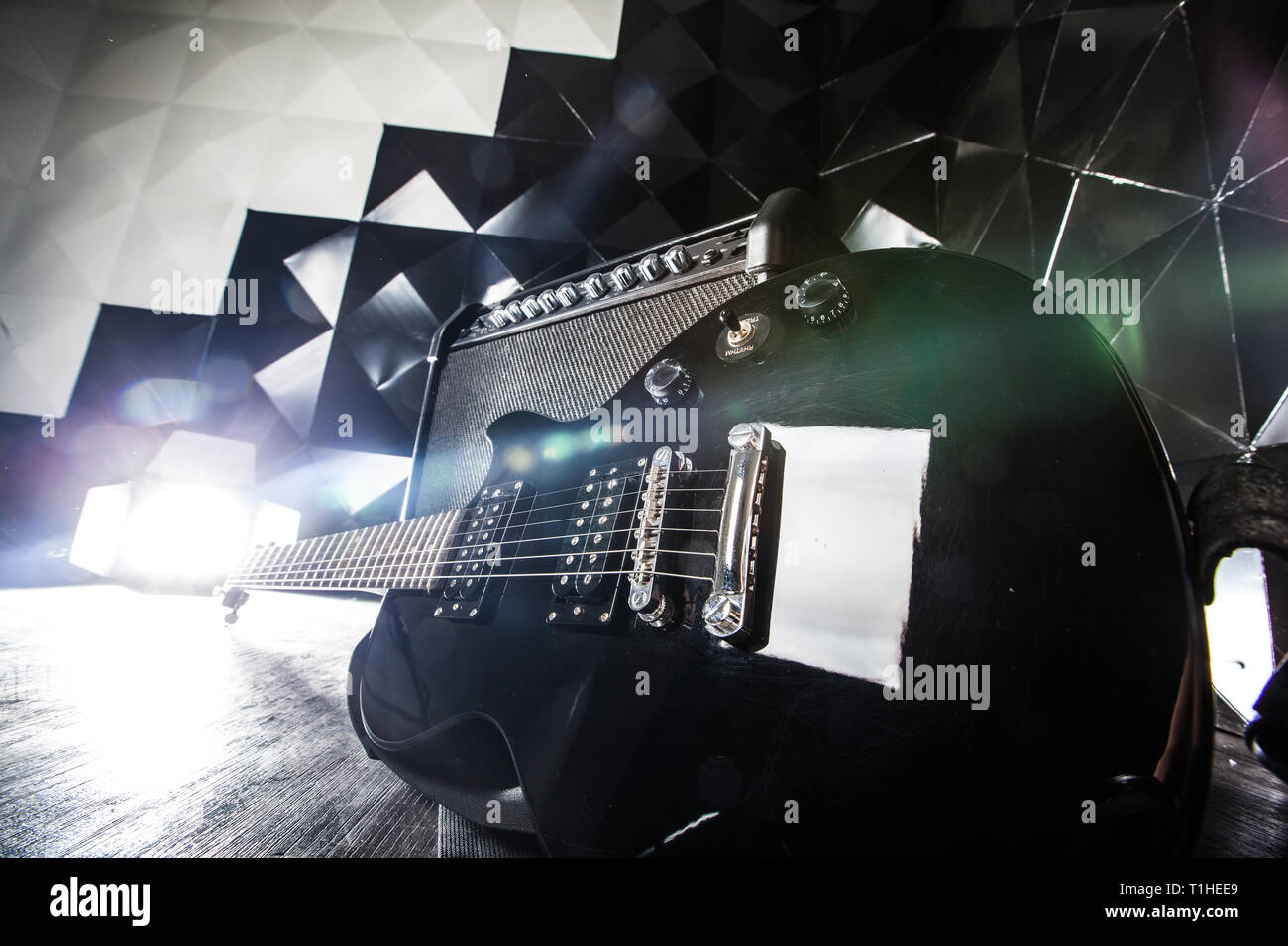 electric guitar and classic amplifier on a dark background Stock Photo ...
