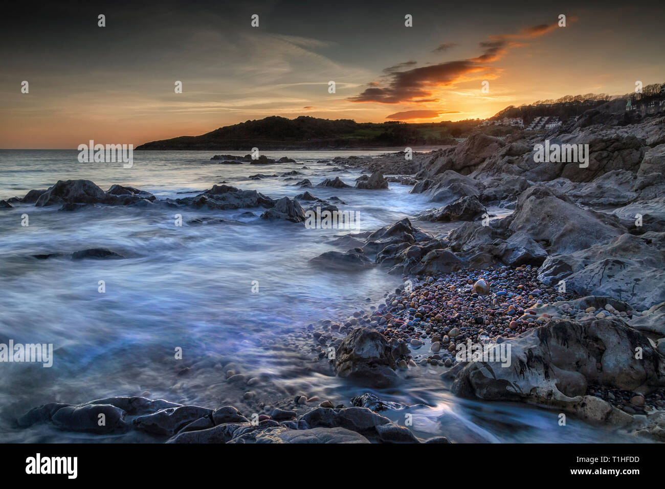 Rotherslade Bay sunset Stock Photo - Alamy