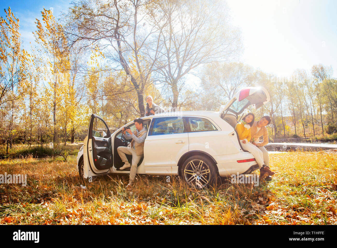 Young men and women in the outdoor outing Stock Photo - Alamy