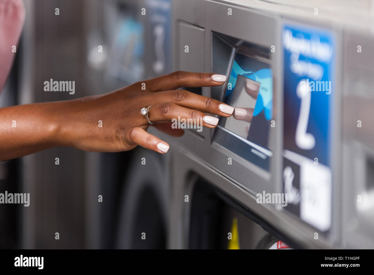 African woman use washing machine hi-res stock photography and images ...