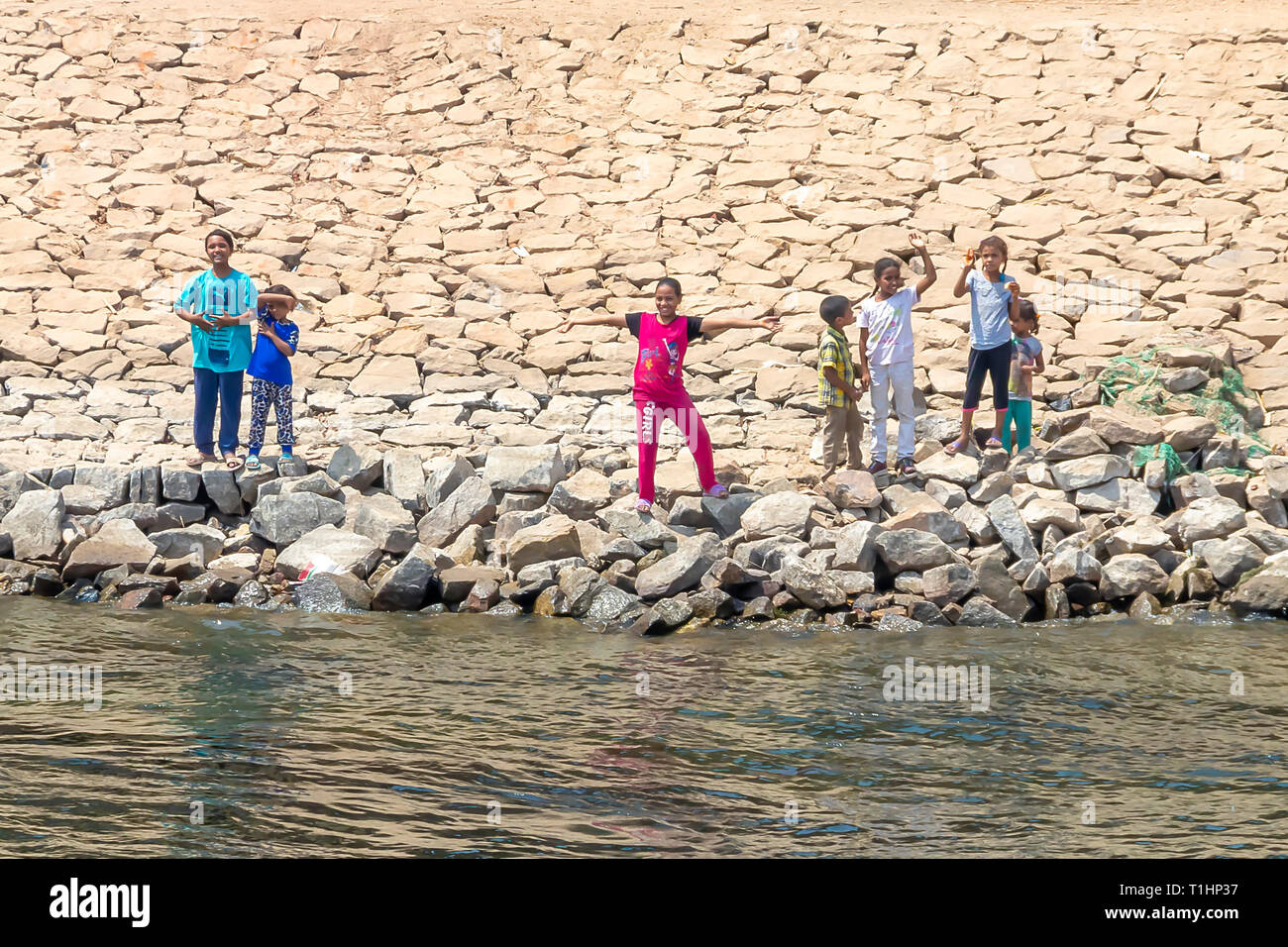 Aswan, Egypt - September 13, 2018: Children waving to Nile Cruise ...
