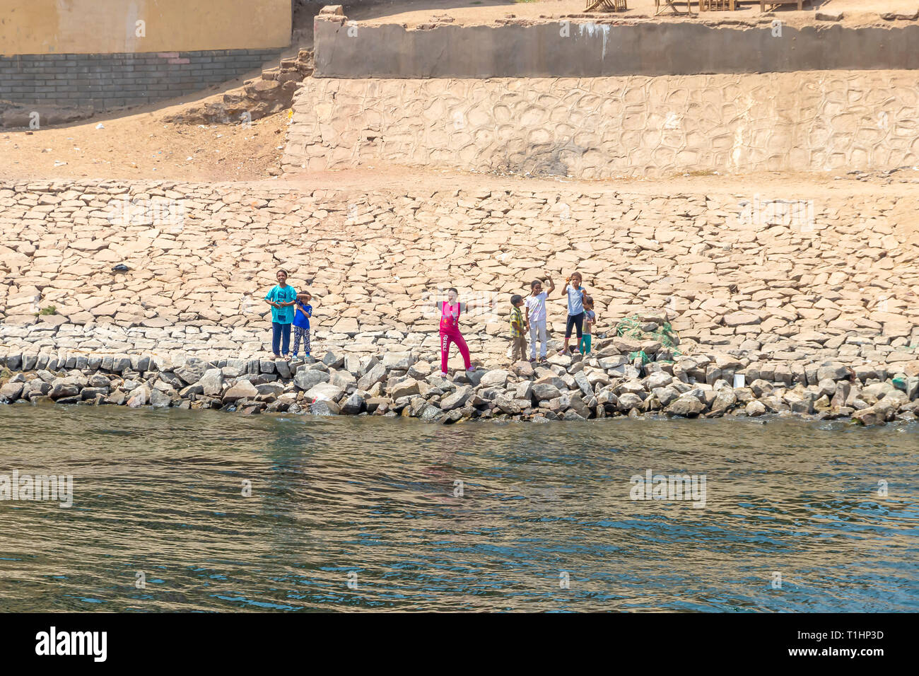 Aswan, Egypt - September 13, 2018: Children waving to Nile Cruise ...