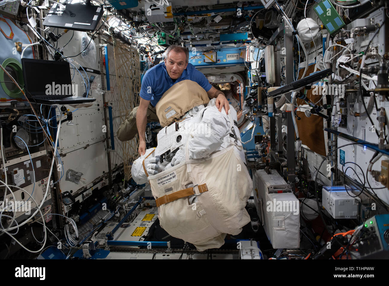 Canadian Space Agency astronaut David Saint-Jacques moves a U.S ...