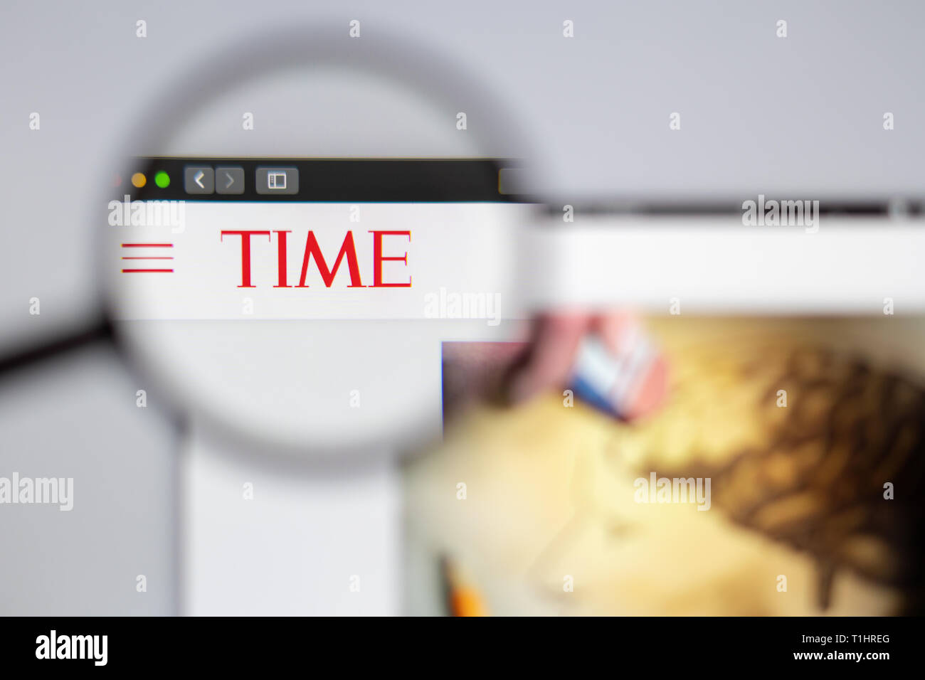 News media Time website homepage. Time logo visible through a ...