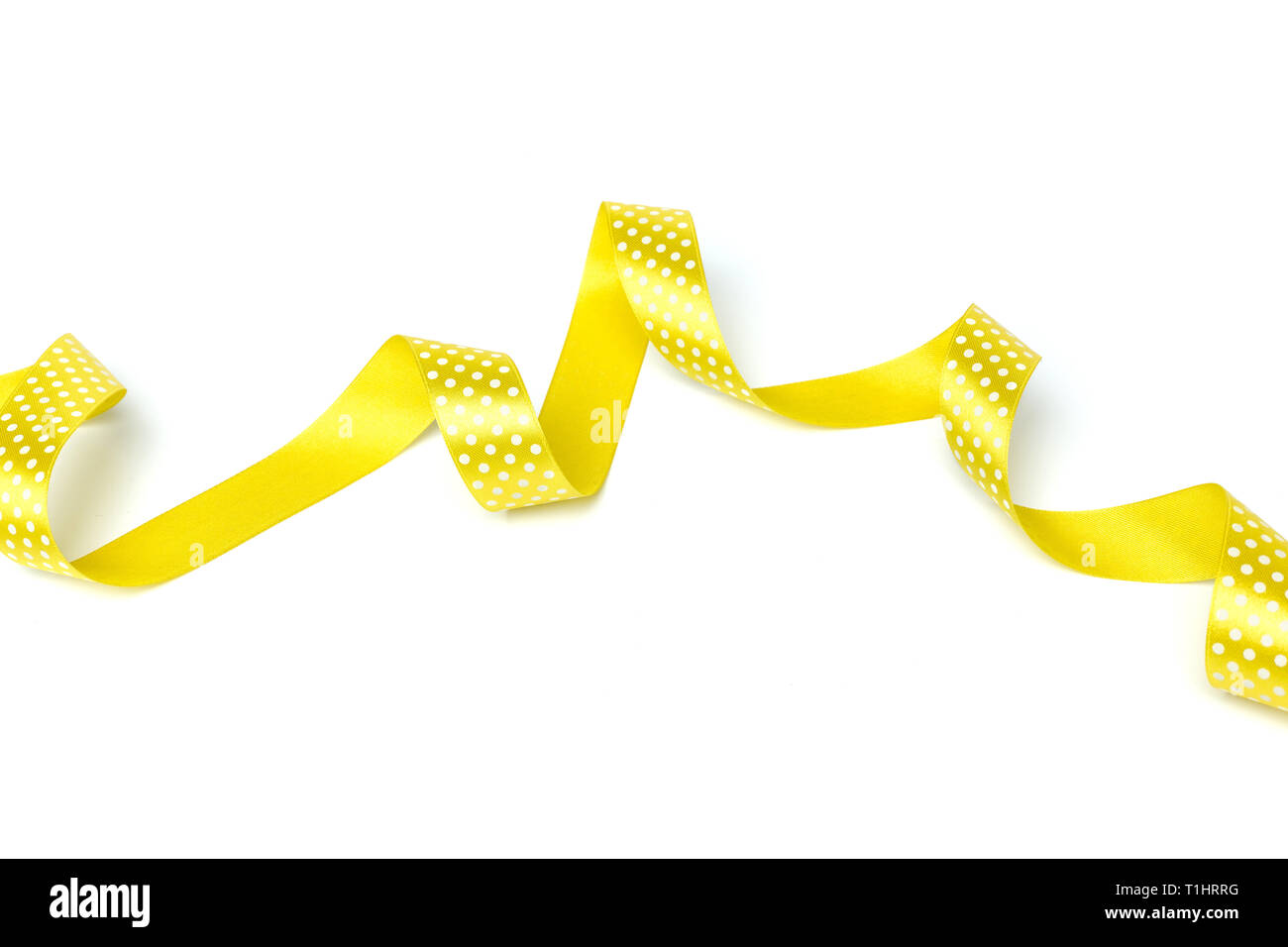 Yellow ribbons isolated on white Stock Photo - Alamy