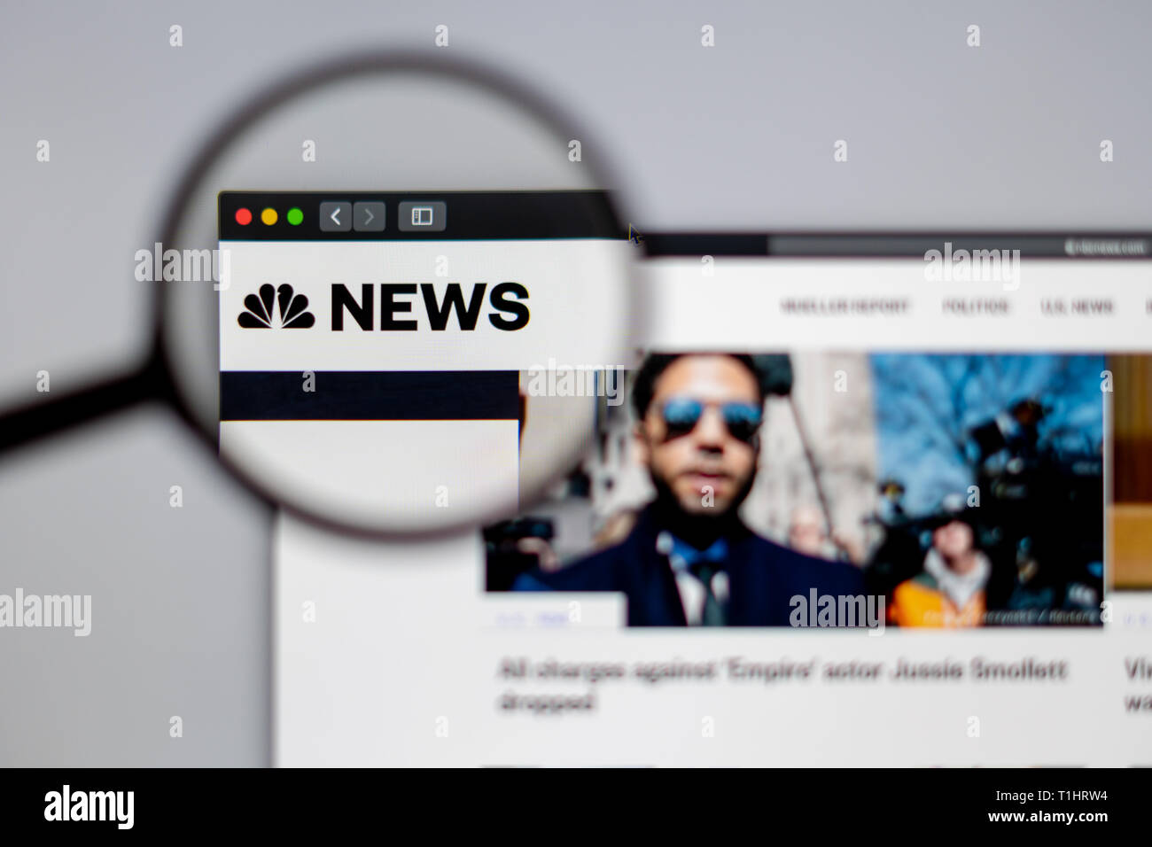 News media NBC website homepage. NBC logo visible through a magnifying ...