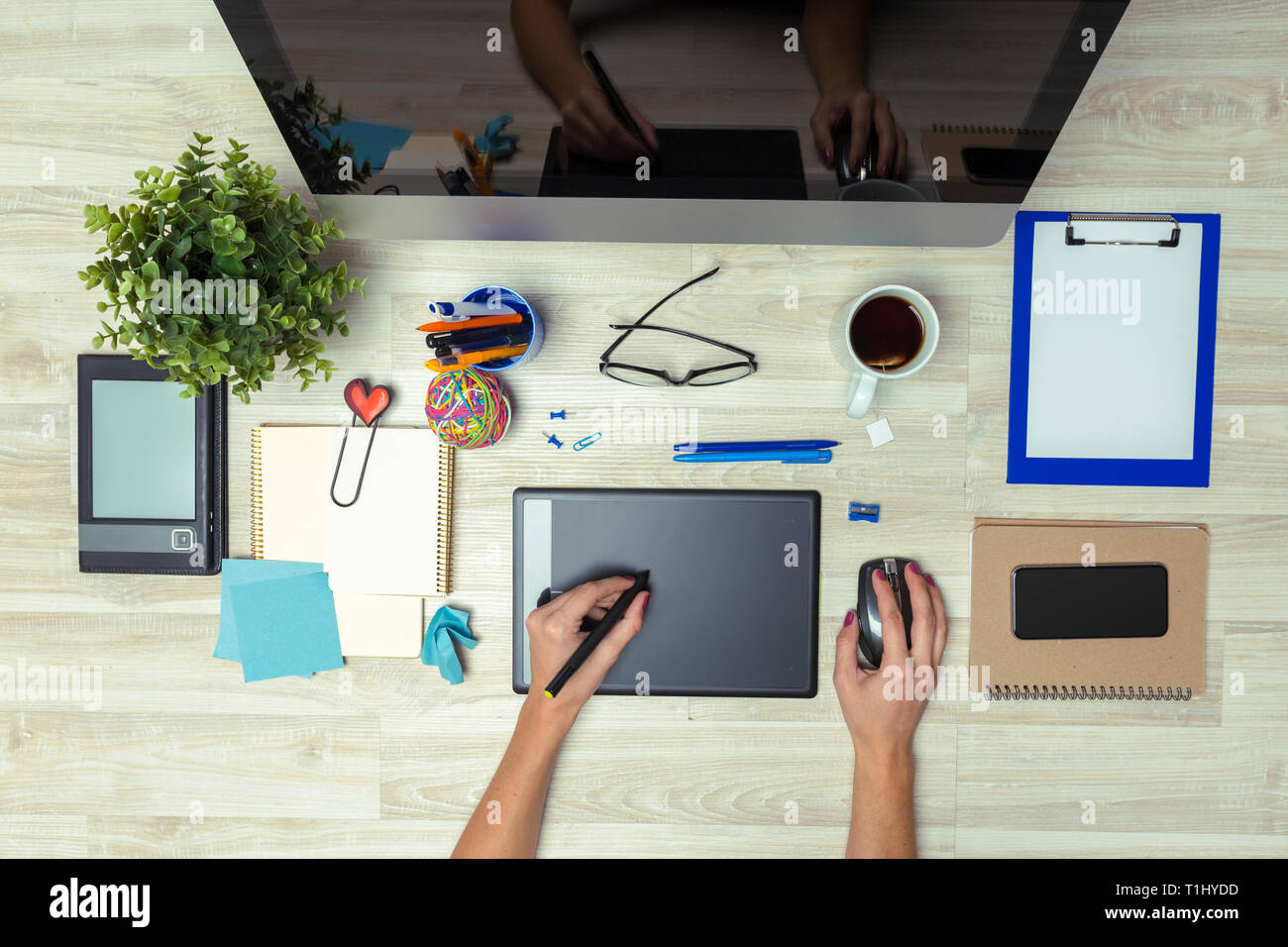 Hand of graphic designer working with stilus and tablet Stock Photo - Alamy