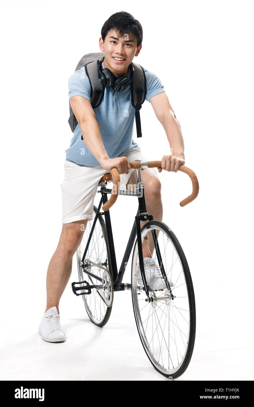 The young college students to ride a bicycle Stock Photo - Alamy