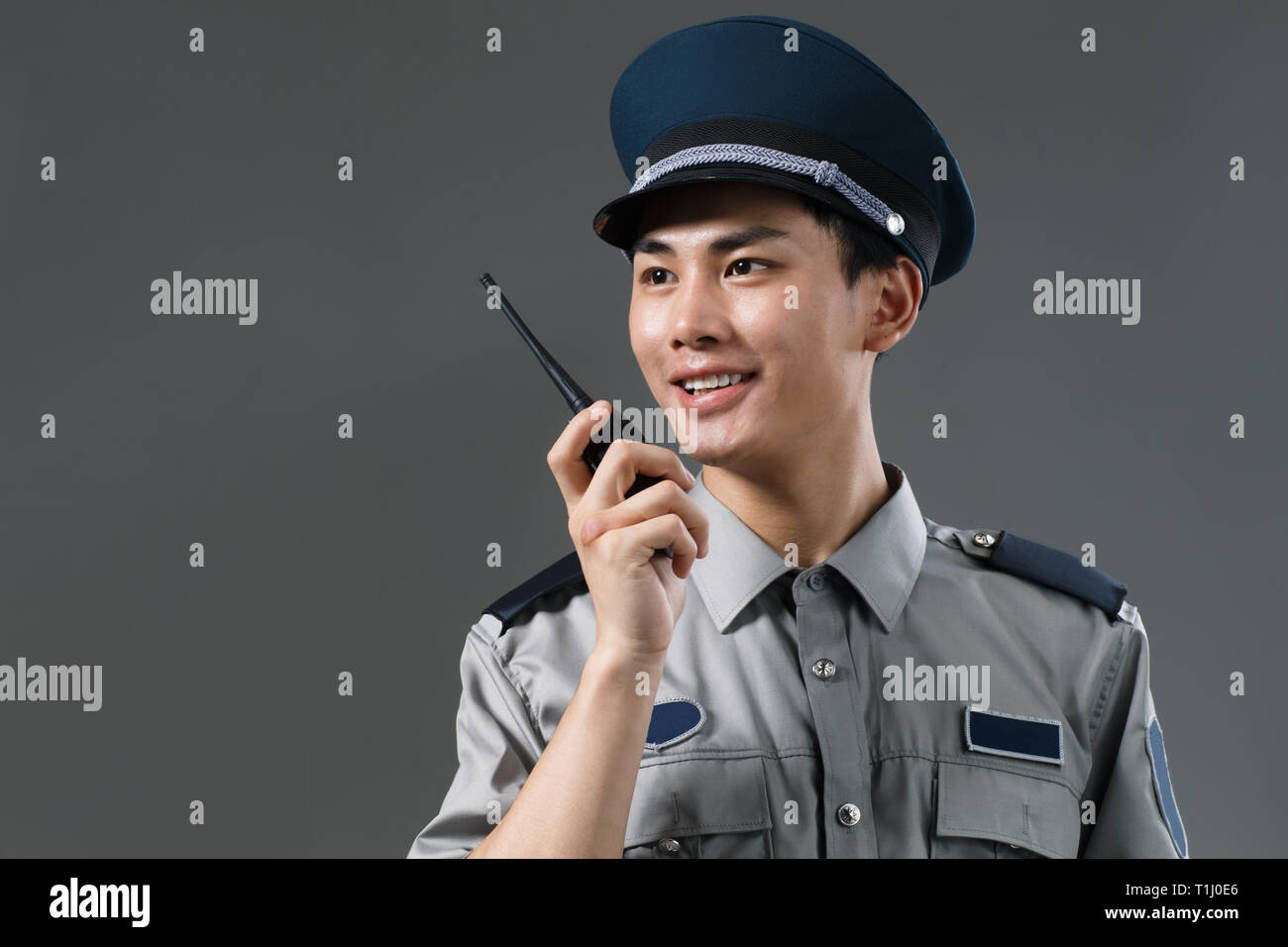 Security guard man smiling hi-res stock photography and images - Alamy