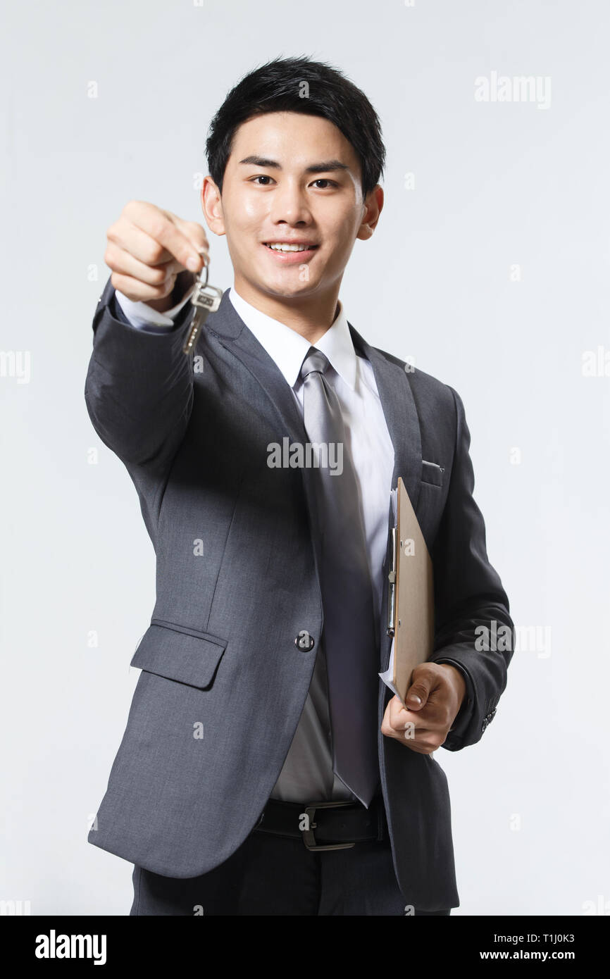 Business man with a key Stock Photo - Alamy