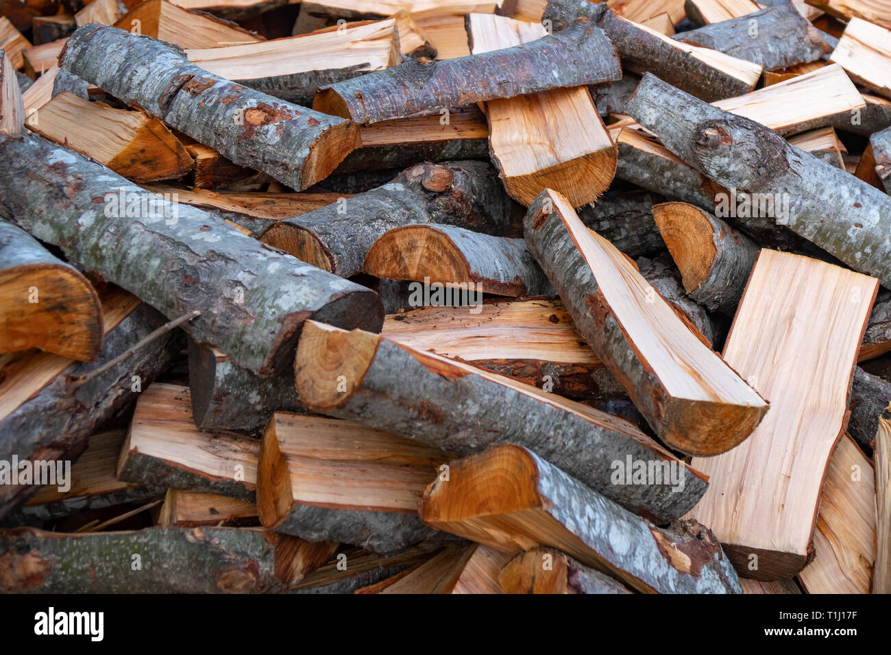 Preparation of firewood for the winter. firewood background, Stacks of ...