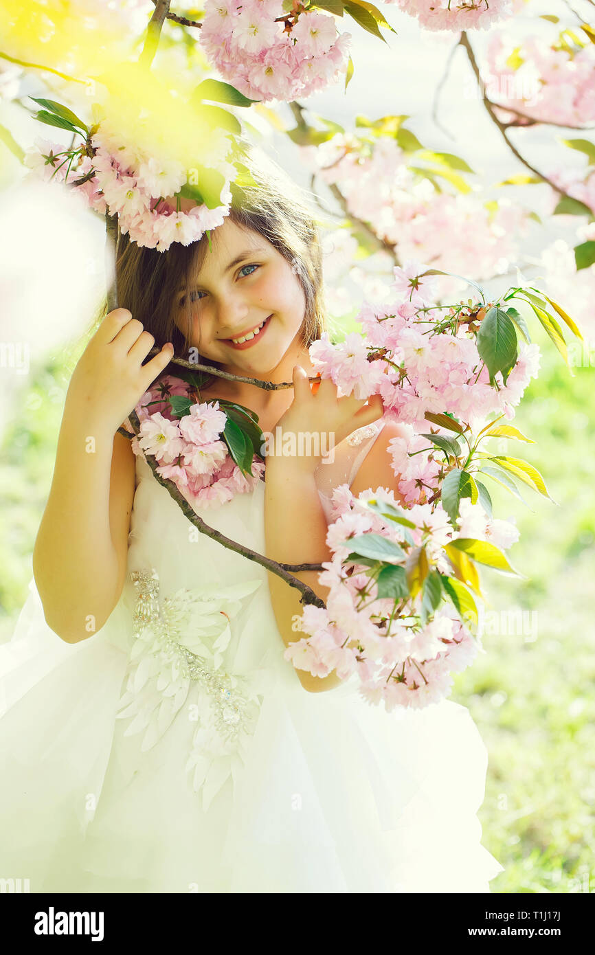 Little girl in spring bloom Stock Photo - Alamy