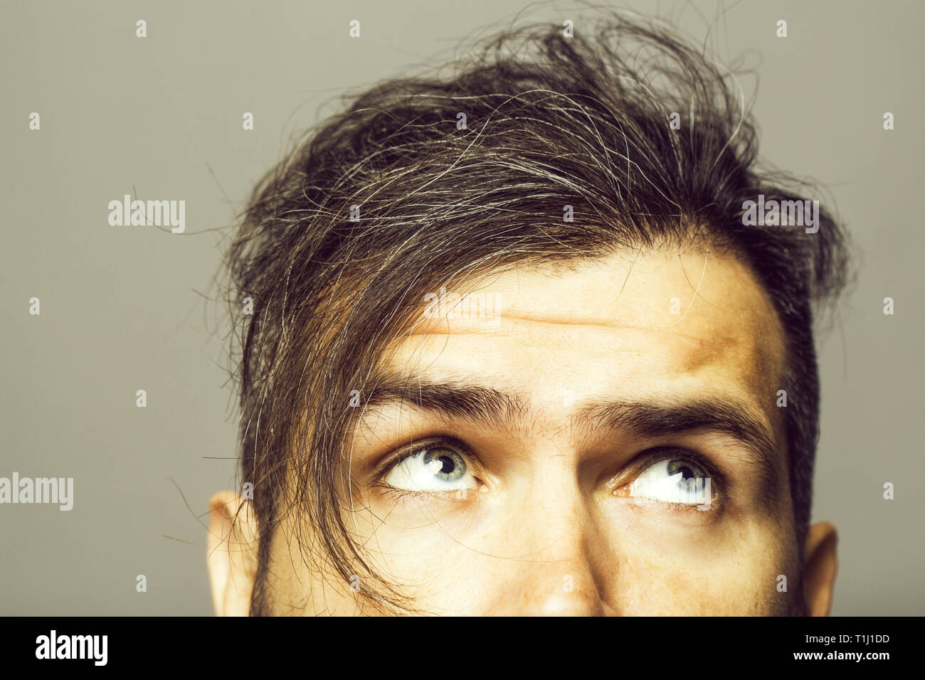 male face with scared eyes Stock Photo - Alamy