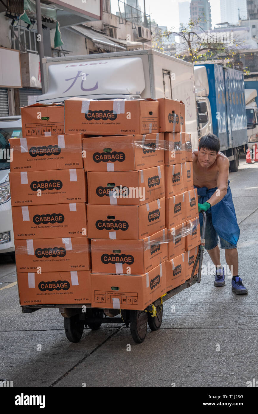 Pushing cart hi-res stock photography and images - Alamy