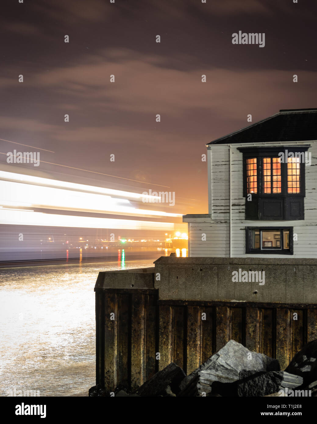 Ferry light trails passing Portsmouth harbour entrance Stock Photo - Alamy